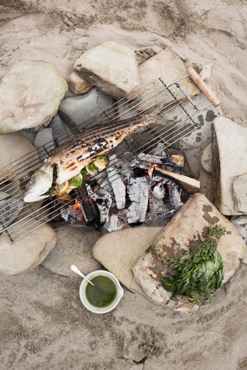 Fire-pit wild sea bass with verde sauce by Simon Stallard